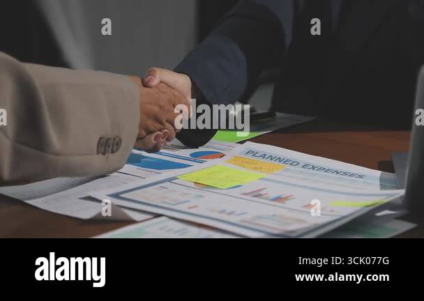 business people shaking hands, finishing a meeting meeting, in the ...