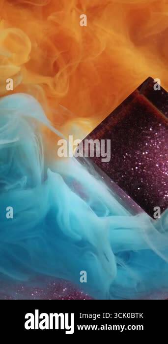Vertical video. Multicolored smoke. Bright fume. Blue orange blur ...
