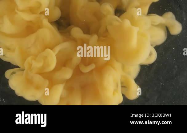Steam liquid. Splash paint mix. Defocused yellow color smoke texture ...