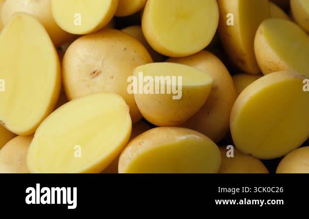 Fresh Raw Potatoes Cut In Half Close-Up Rotate Stock Video Footage - Alamy