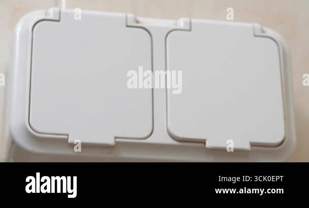 Plug is insert into socket. Turning on the electrical appliance Stock ...