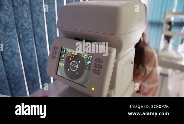 An image capturing a patient during an eye exam, showing detailed eye ...
