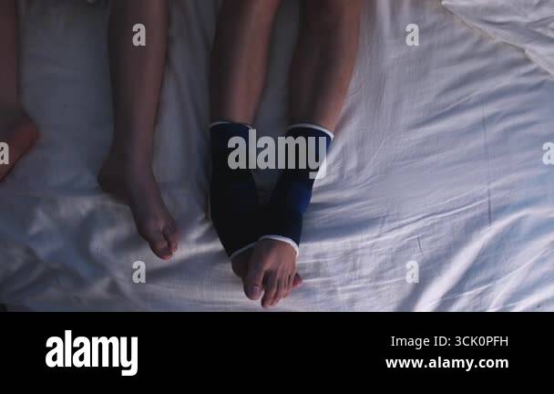 Close-up, woman's irritated legs with ankle support, sleepless from ...