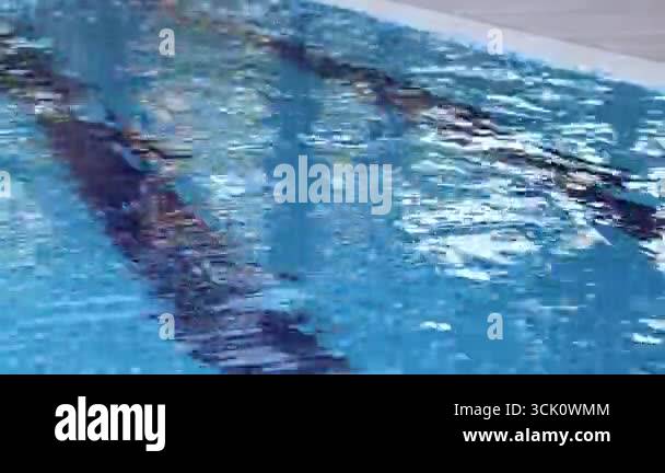 Small ripples on the surface of the water in the pool. Swimming pool ...