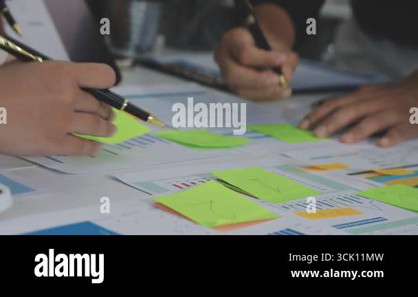 businessman analyzing data with pen on paper Stock Video Footage - Alamy