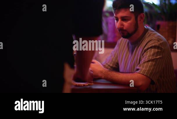 Pub order. Waiter serving drink. Customer getting refreshing alcoholic ...