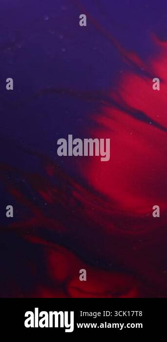 Vertical video. Splash ink. Mix color. Defocused red maroon purple ...