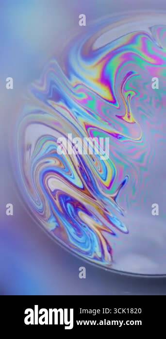 Vertical video. Spectrum soap. Paint mix. Multicolor oil fuel texture ...