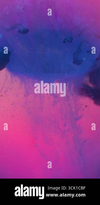 Vertical video. Defocused dripping. Diamond gemstone. Pink purple fluid ...