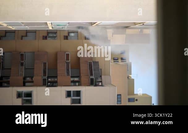 Residential building on fire, flames and smoke breaking out from the ...
