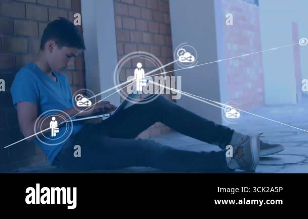 Boy typing on laptop and generating expanding tech network with user ...