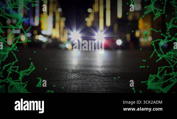 Night street view activating green network and approaching headlamps ...