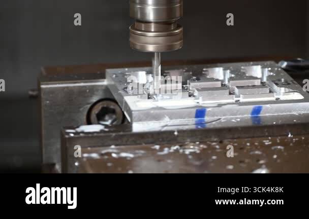 The CNC milling machine finish cut the aluminum parts with flat nose ...