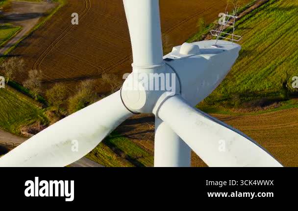 Wind farm generating green energy. Wind turbine turning circular blades ...