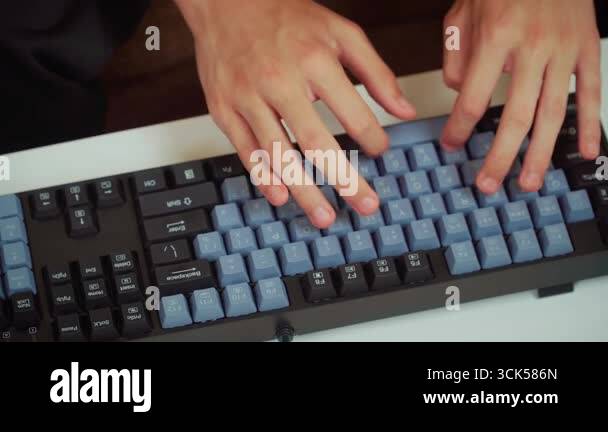 Hands typing on computer keyboard. Unrecognizable person pressing buttons on pc keyboard ...
