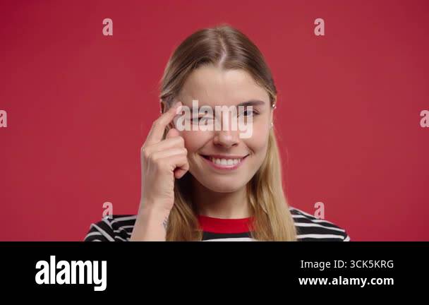 Smart young woman gesture-you, think about it. Student looking camera ...