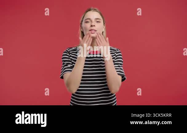 Charming woman model blows kiss with soft, affectionate gesture ...