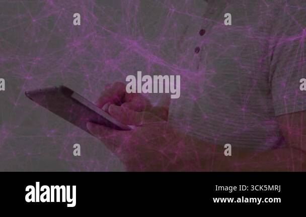 Man steadying tablet by wall tapping screen and swiping through network ...