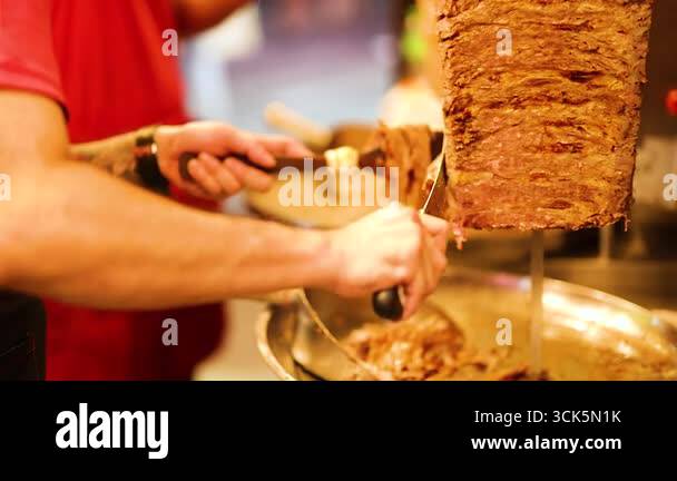 Chef slicing kebab meat at Phuket street food market stall Stock Video ...