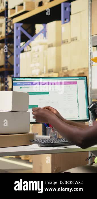 Vertical Video Worker applying labels and scanning tracking info ...