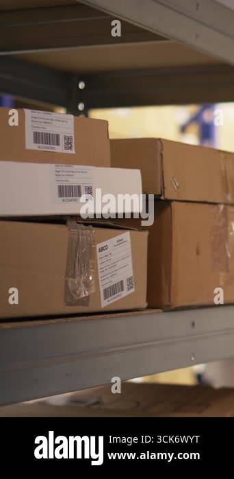 Vertical Video Close up of black worker using a barcode scanner to ...
