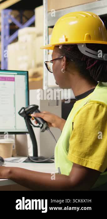 Vertical Video Black warehouse assistant register tracking info on tags ...