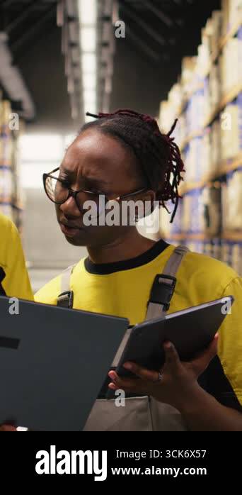 Vertical Video Large business warehouse staff handling order ...