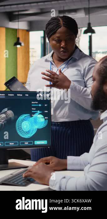 Coworkers use AI tech to make wind turbine more sustainable, reducing carbon footprint. RD ...