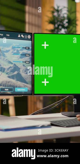 Engineer uses green screen mockup PC to do clean energy production ...