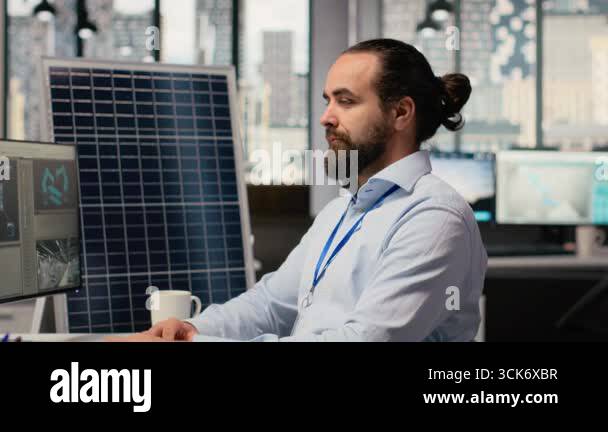 Portrait of happy sustainable energy researcher using simulation ...