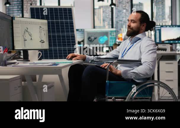 Man with paraplegia in inclusive RD office designs green technology ...