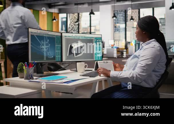 Product developer in office using advanced solar cell technology to create renewable energy ...