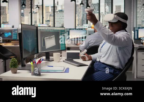 Technician using VR headset to create solar powered device design using ...