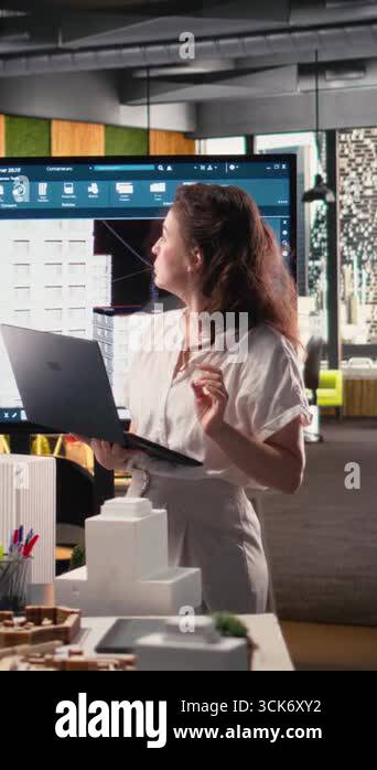 Vertical Video Professional property developer analyzes zoning regulations and project plans ...