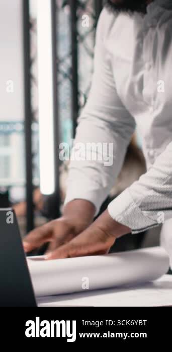 Vertical Video Black property engineer collecting construction details ...