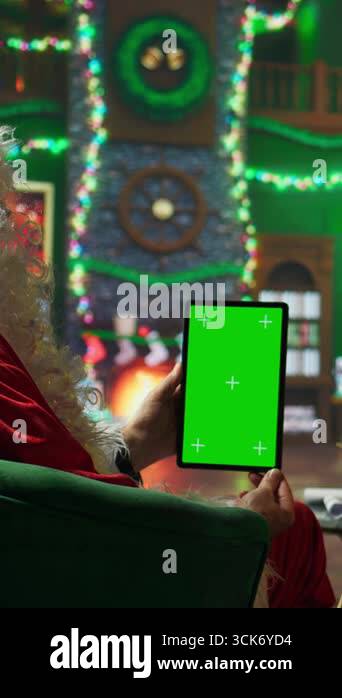 Vertical video Santa Claus responding to kids requesting gifts, typing ...