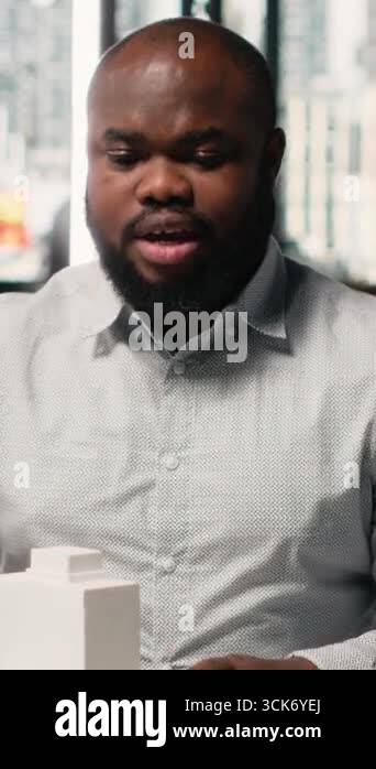 Vertical Video Engineer and designer working together on real estate interior design, using ...