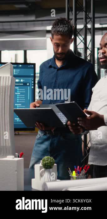 Vertical Video Multiethnic group of developers and contractors ...