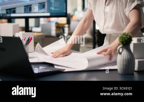 Real estate developer reviews master plan with construction layouts on ...