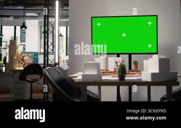 Clean workspace designed for property development with green screen on ...