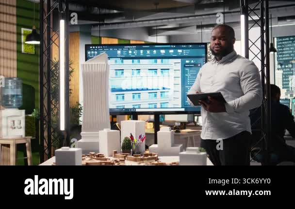 Property investment developer checks blueprints and layout plans ...