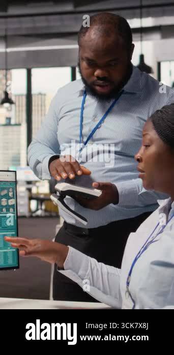 Supervisor providing feedback to researcher creating advanced solar ...