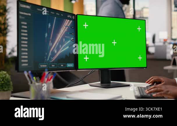 Engineer looks at power lines analytics dashboard on isolated screen PC ...