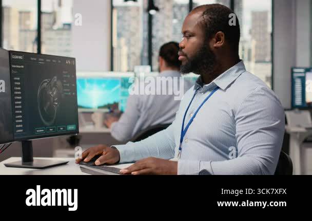 Engineer in office working on wind turbine CAD design, doing ...