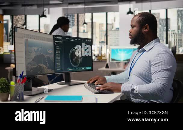 Engineer in office working on wind turbine CAD design, doing ...