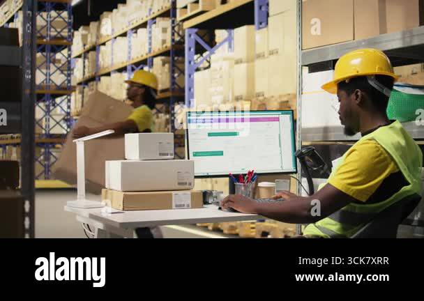 Black warehouse staff verifying cargo goods during import export ...