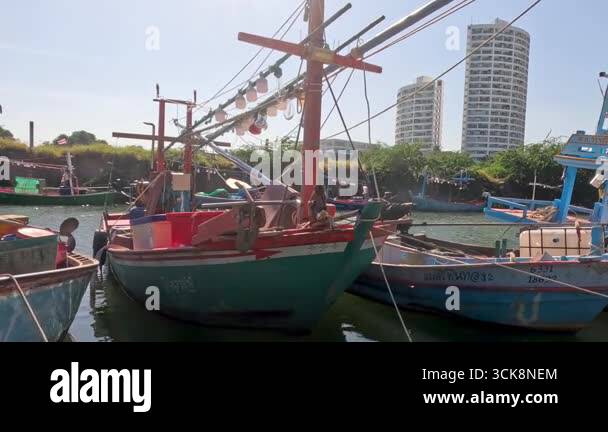 Colorful fishing boats moored in a busy harbor Stock Video Footage - Alamy