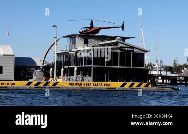 Helicopter landing on a boat's helipad in Gold Coast Stock Video ...