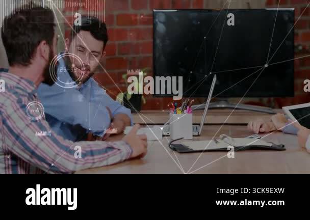 Man in blue shirt explaining data gesture, drawing colleagues into ...