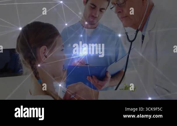 Doctor placing stethoscope on child chest, nurse noting network ...